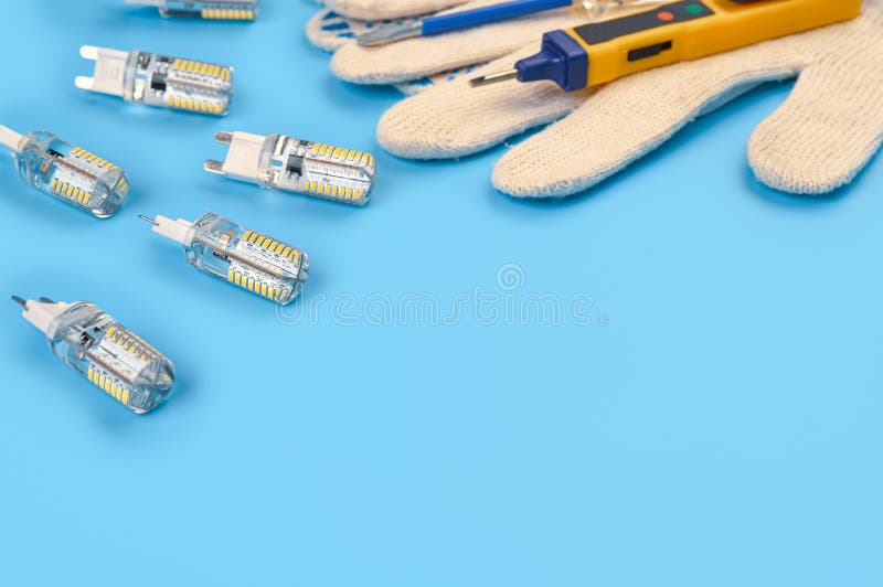 .LED Lamps with an Electrician Tool on a Blue Background Stock Photo ...