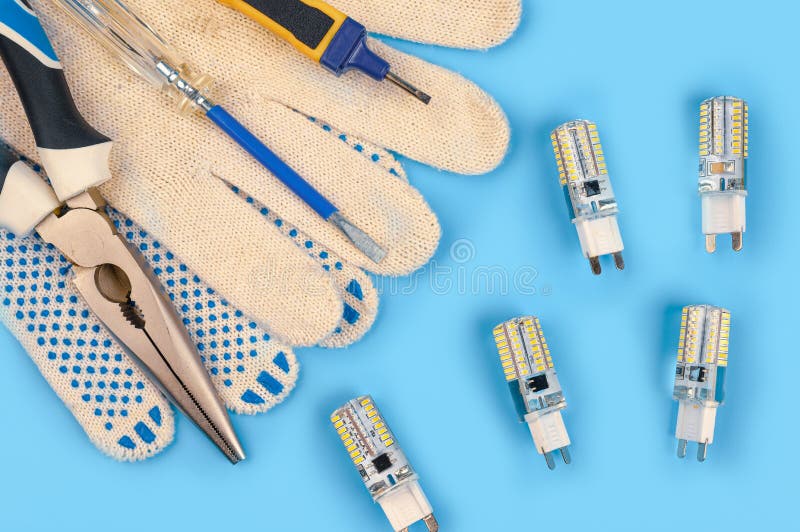 .LED Lamps with an Electrician Tool on a Blue Background Stock Image ...