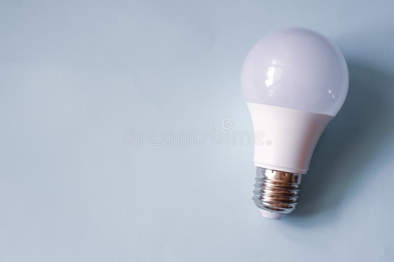 LED Light Bulb on a Blue Background Stock Photo - Image of bulb, place ...
