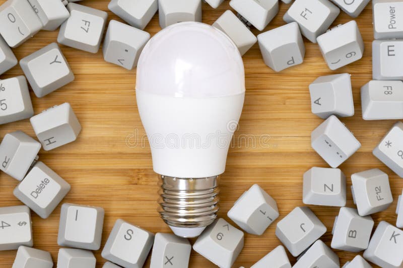 LED Light Bulb among Computer Keyboard Keys Stock Photo - Image of ...