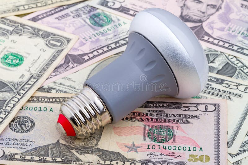 LED light bulb on dollar stock photo. Image of dollar - 48232430