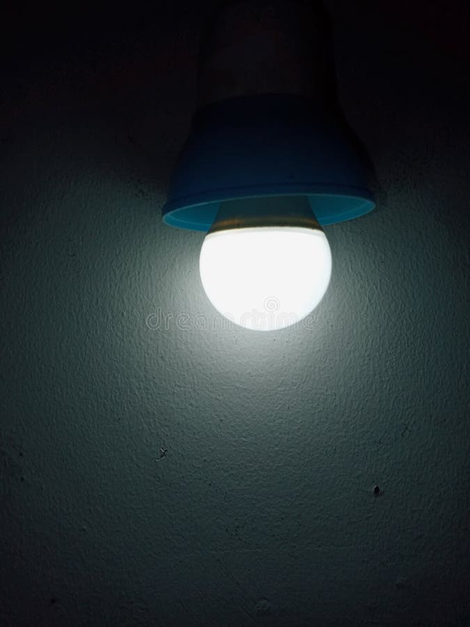 LED Light Bulb Glowing on Wall at Night Stock Photo - Image of bulb ...