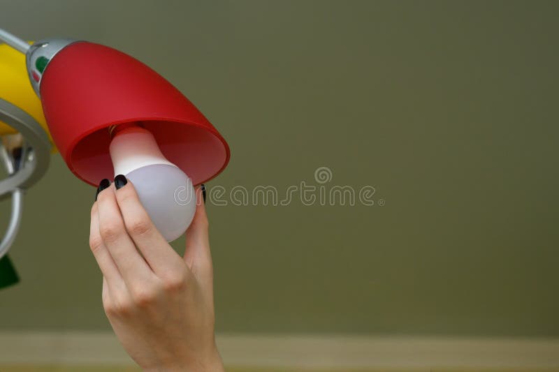 LED light bulb in hand stock photo. Image of saving - 323878578