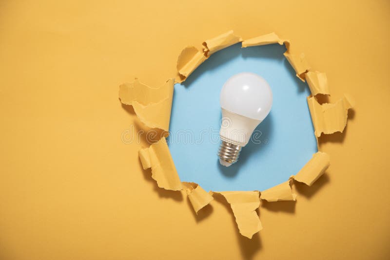 Led Light Bulb and Torn Paper Stock Image - Image of inspiration, light ...