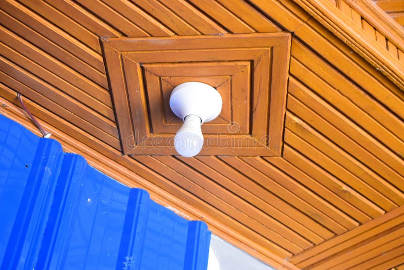 Led Light Bulb on a Wooden Ceiling, Home Lighting Lamps Stock Photo ...