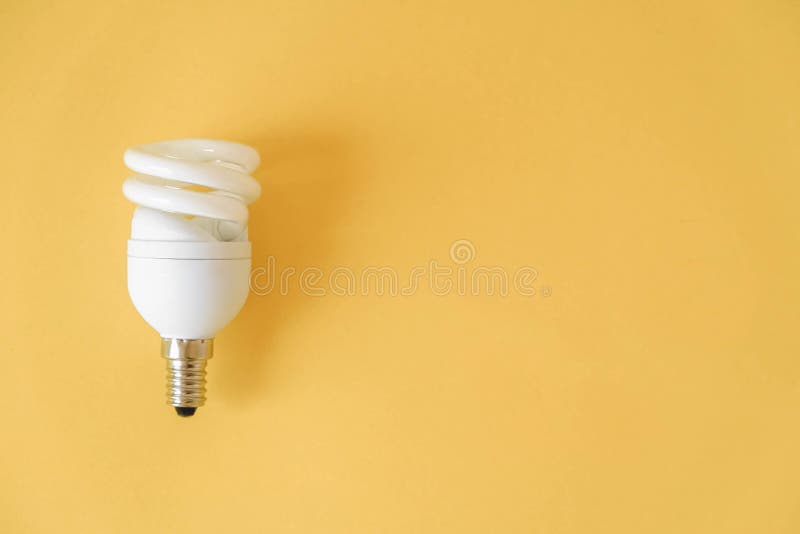 LED Light Bulb on Yellow Background. Top View Stock Photo - Image of ...