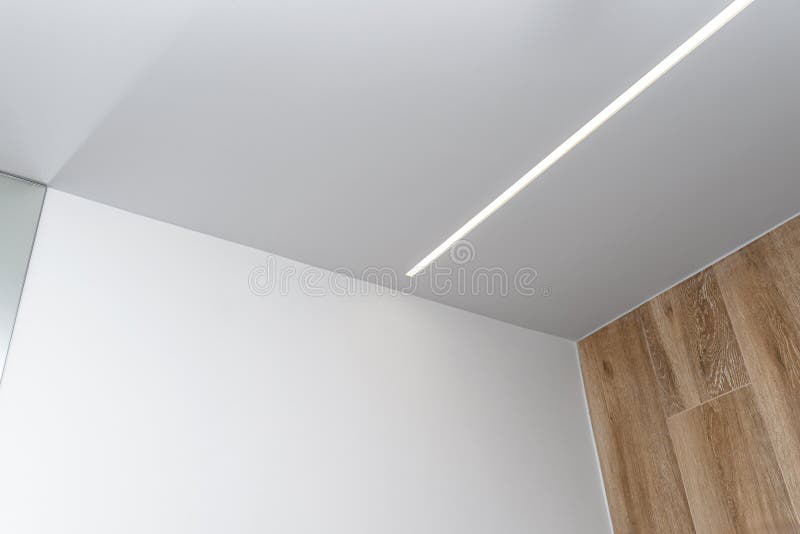 LED Light Strips Mounted in the Wall and Ceiling in a Modern Bathroom ...
