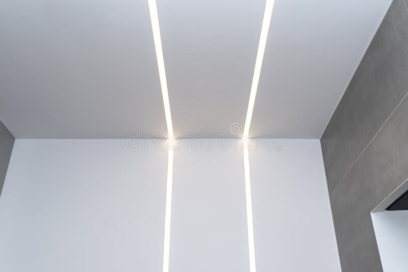 LED Light Strips Mounted in the Wall and Ceiling in a Modern Bathroom ...