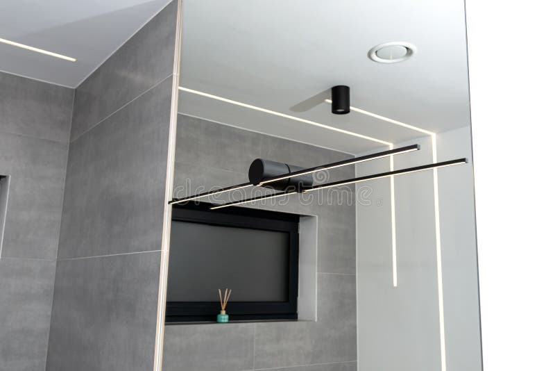 LED Light Strips Mounted in the Wall and Ceiling in a Modern Bathroom ...