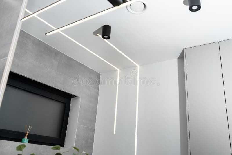 LED Light Strips Mounted in the Wall and Ceiling in a Modern Bathroom ...