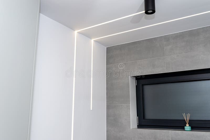 LED Light Strips Mounted in the Wall and Ceiling in a Modern Bathroom ...