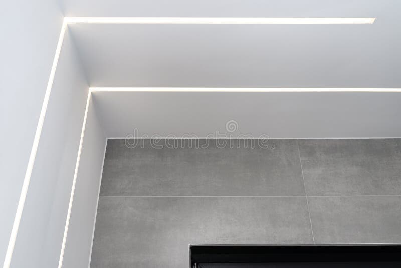 LED Light Strips Mounted in the Wall and Ceiling in a Modern Bathroom ...