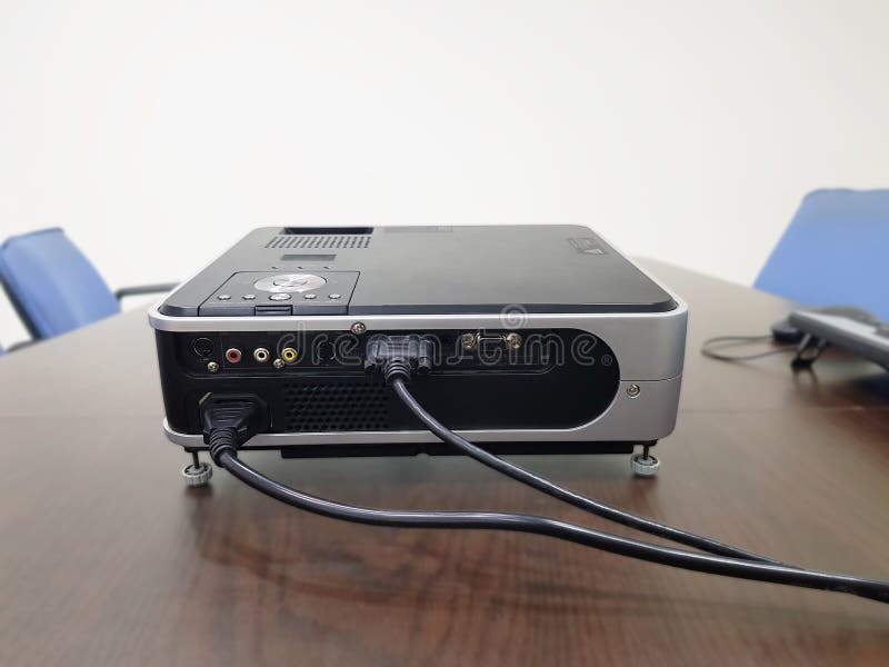 Projector on wood table stock image. Image of interior - 101120431