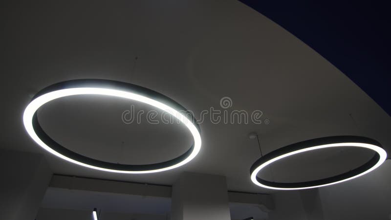 LED Ring Chandeliers Mounted on Ceiling in Spacious Room Stock Video ...