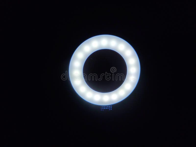 A Circular LED Ring Light Glows Softly Against a Dark Background Stock ...