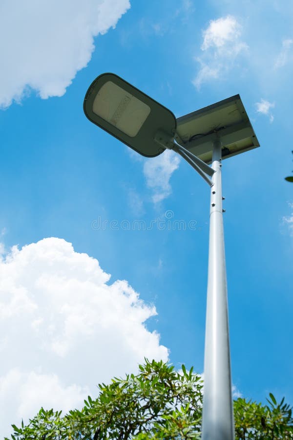 LED Spotlight with Solar Power in Street Garden and Blue Sky Background ...