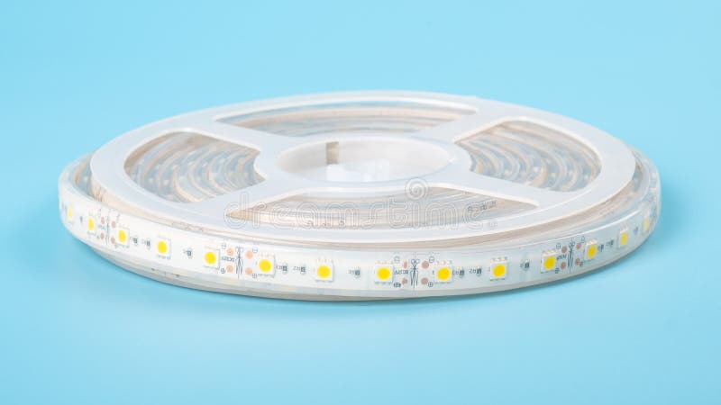 Led Strip on Blue Background, Coil of Diode Light Stock Image - Image ...