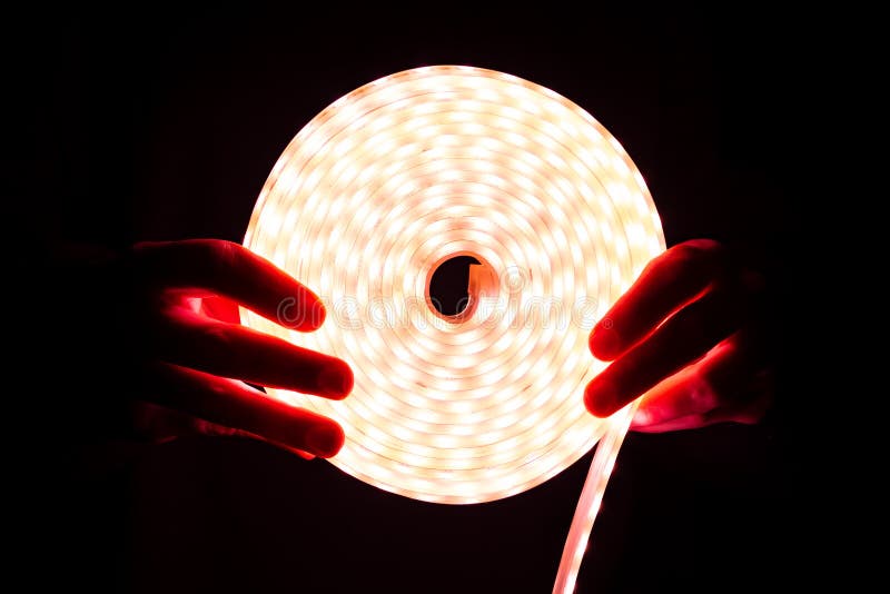 LED Strip Light, Red Coil Diode Lighting in Hand Stock Photo - Image of ...
