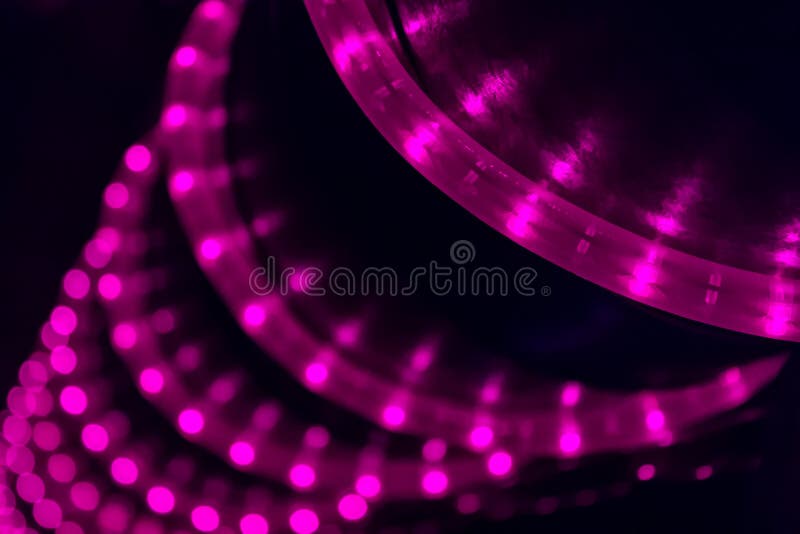 LED Violet Light String Spiral Over Black Pillar in Club Stock Photo ...