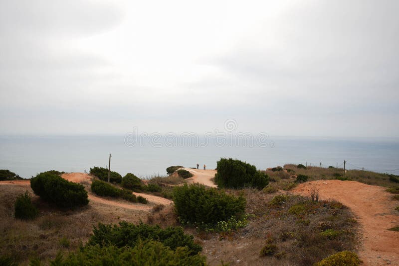 Ledge with Red Soil Overlooking the Ocean Stock Image - Image of rough ...