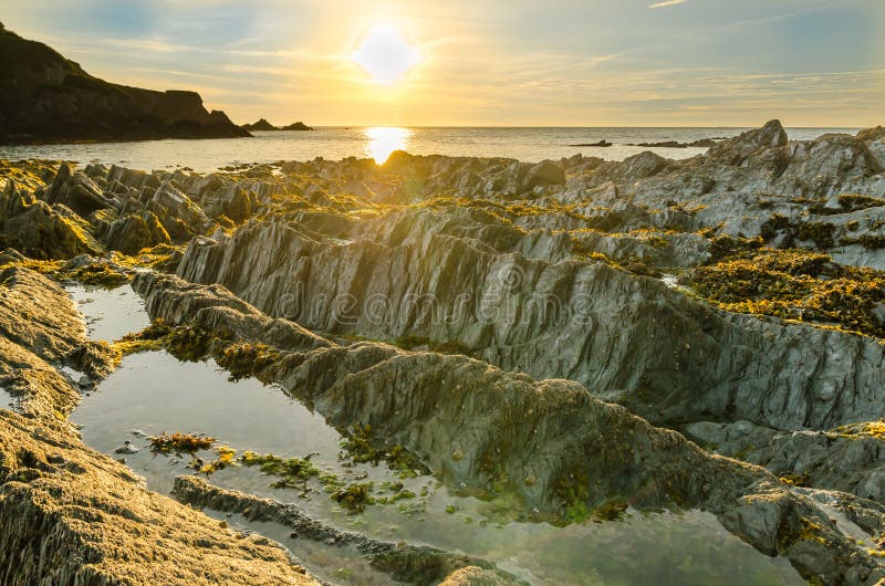Lee Bay sunset stock photo. Image of rock, north, reflection - 42029056