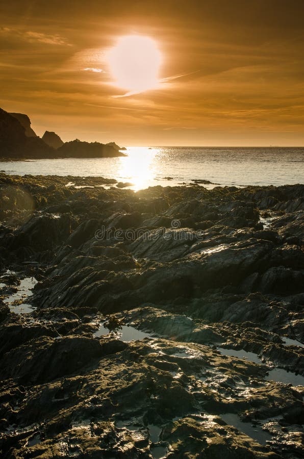 Lee Bay sunset stock photo. Image of sand, seaweed, channel - 42029672