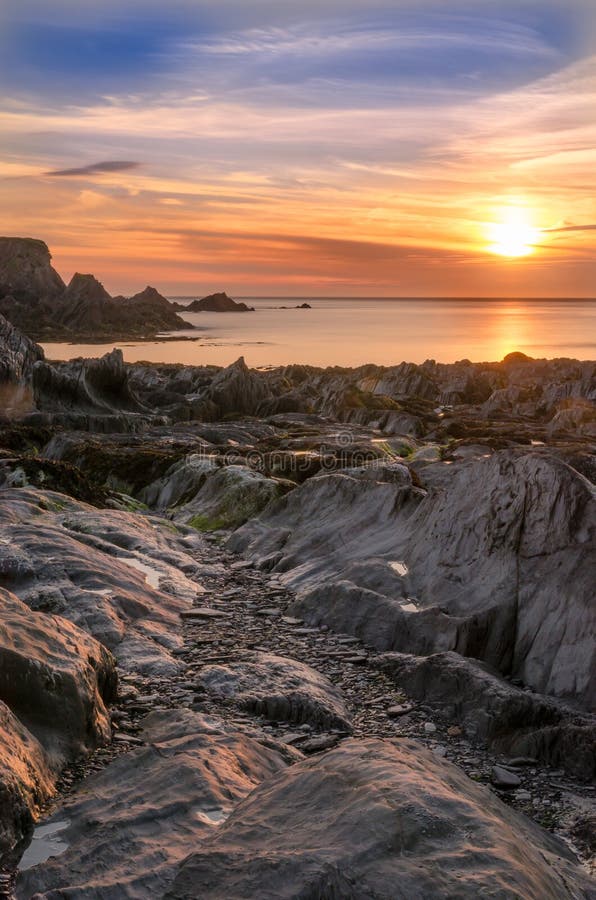 Lee Bay sunset stock photo. Image of ocean, england, clover - 42034026