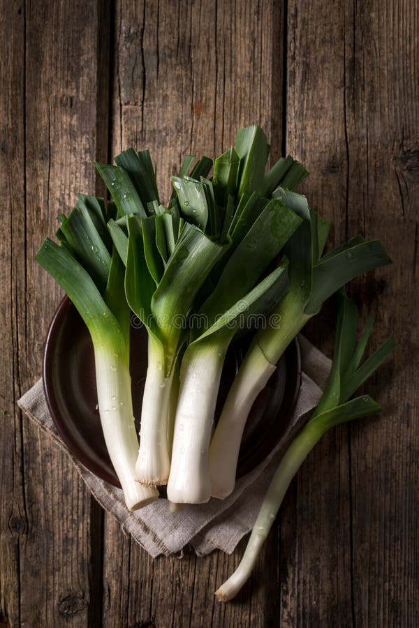 Leek on a Plate on a Wooden Table, Top View Stock Image - Image of ...
