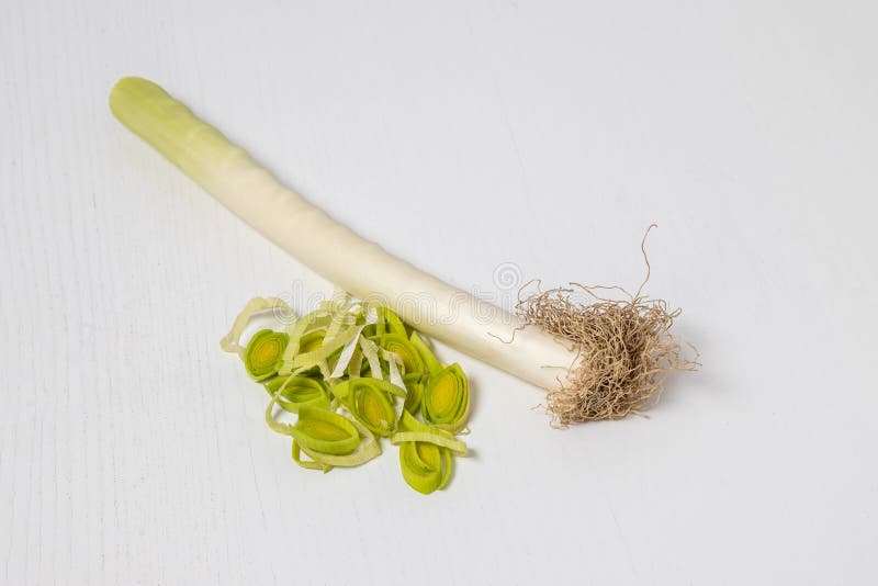 Leek with Root, Cut Green Leek Around. Photo Isolated on White Table ...