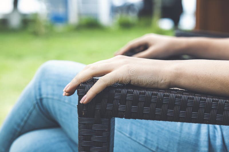 Left Arm of the Girl Resting in the Swinging Chair. Stock Photo - Image ...