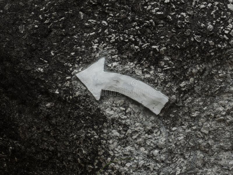 Left Arrow on a stone stock image. Image of surface, fear - 71532375