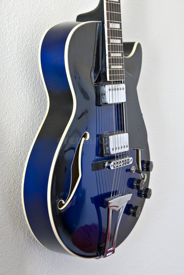 Left of blue jazz guitar stock image. Image of detail - 2340155