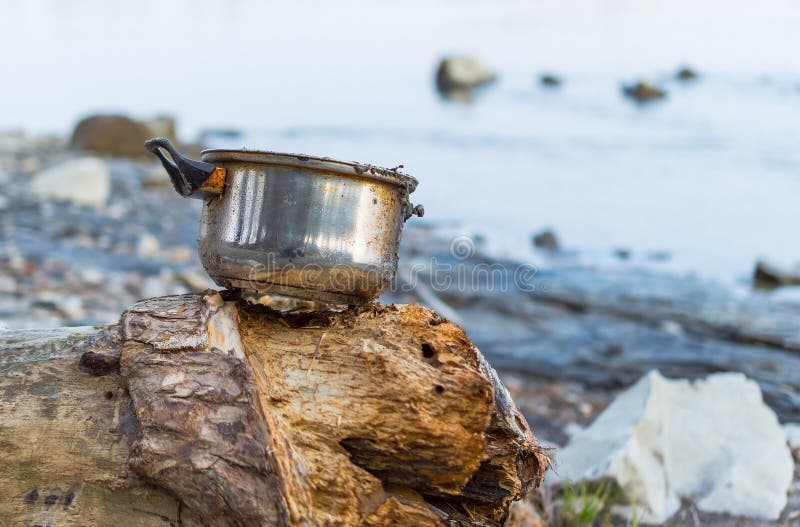 Left Dirty Pot on the River Bank Stock Image - Image of background ...