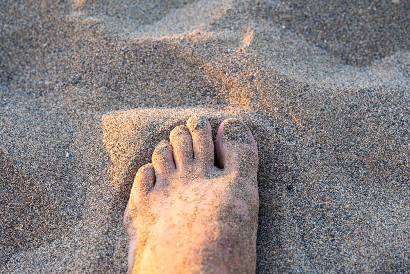 Left Foot Covered by the Beach Sand Stock Image - Image of nail ...