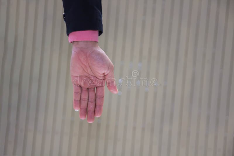 The Left Hand of a Businessman Extends from Above Stock Photo - Image ...