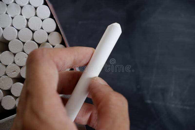 Left Hand Holding a White Chalk and Blackboard Stock Photo - Image of ...