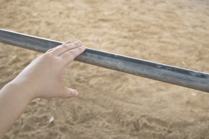 Left Hand of Woman Touch Iron Tube Stock Photo - Image of metal, left ...