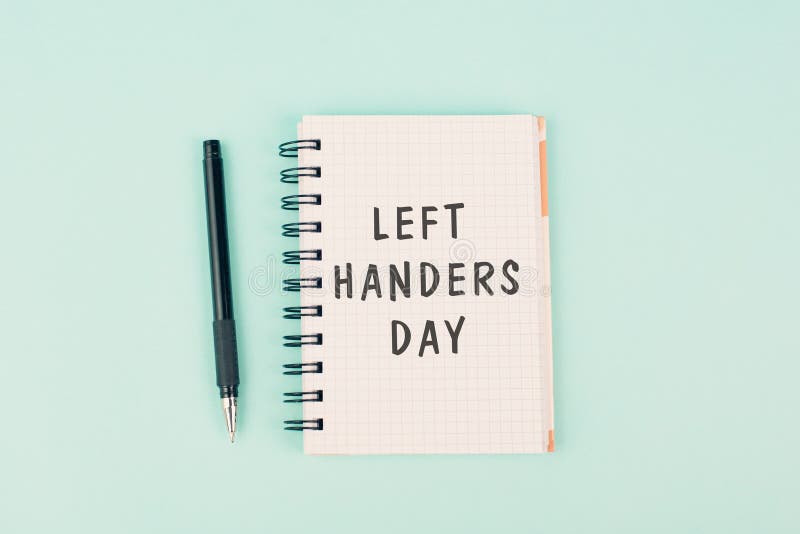 Left Handers Day is Standing on a Notebook, Writing with the Left Hand ...