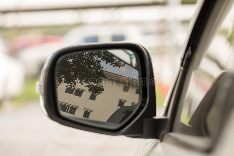 The Left Side Mirror of the Car To Look at the Environment Around the ...