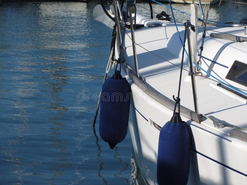 Left Side of White Sailing Boat with Two Blue Fenders Stock Image ...