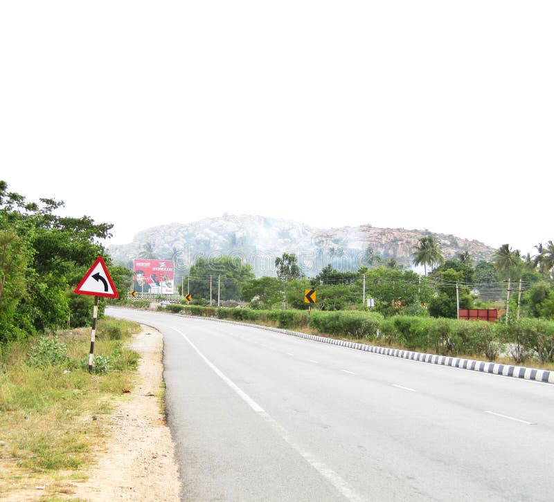 Left Turn Sign Board on a Highway at a Left Curve on Road Stock Image ...