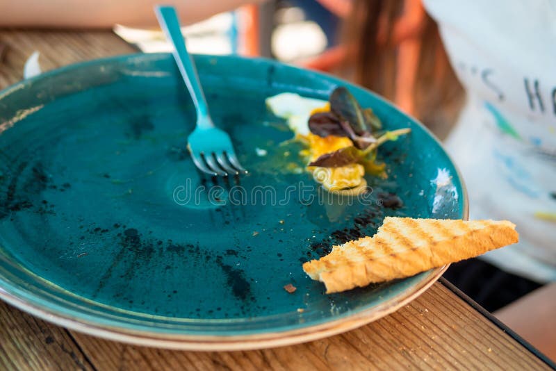 Leftovers on a Plate after a Delicious Breakfast in a Summer Cafe Stock ...