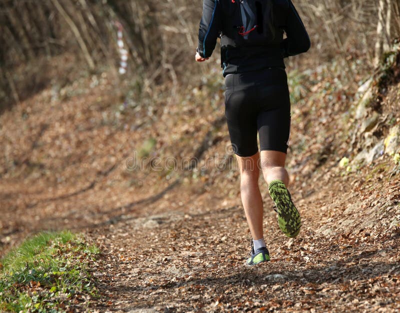 Leg of Athlete Runner from Behind during Racing on the Mountain Stock ...