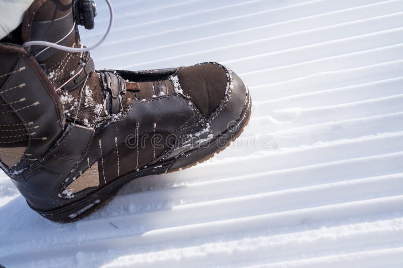 Leg in a Brown Boot Stepping on Track Cleared of Snow. Stock Image ...