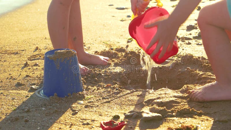 Leg of child stomping mud. stock footage. Video of beach - 93310712