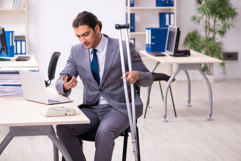 The Leg Injured Employee Working in the Office Stock Photo - Image of ...