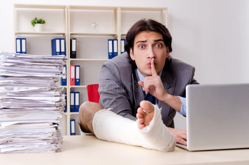 The Leg Injured Employee Working in the Office Stock Image - Image of ...