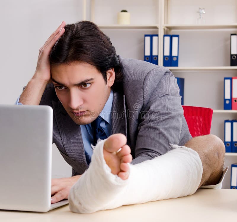 Leg Injured Employee Working in the Office Stock Image - Image of ...