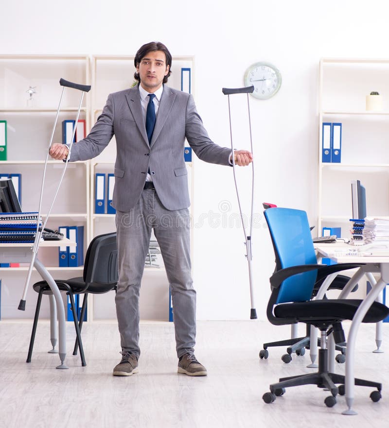 Leg Injured Male Employee Working in the Office Stock Photo - Image of ...