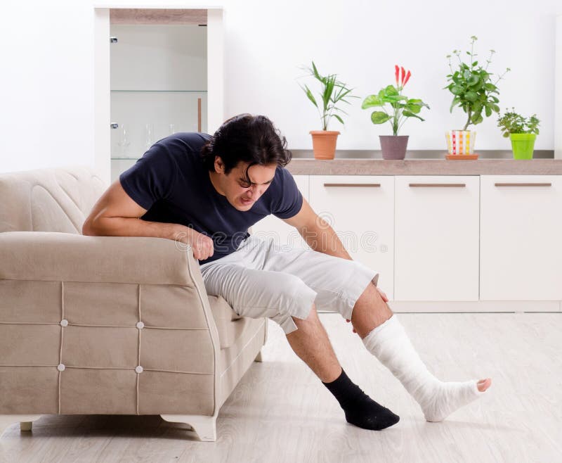 Leg Injured Young Man Suffering at Home Stock Image - Image of bandage ...